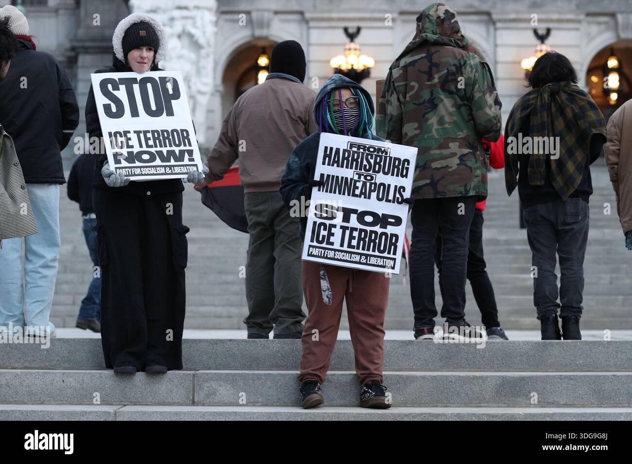 Harrisburg, United States. 15th Jan, 2026. Anti-ICE demonstrators hold ...