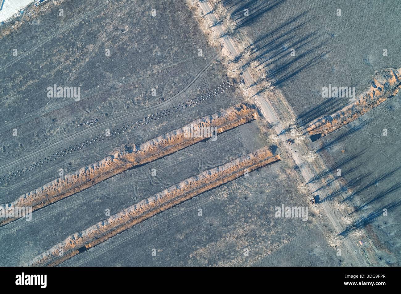 A strategic defensive system featuring deep anti-tank trenches and rows ...