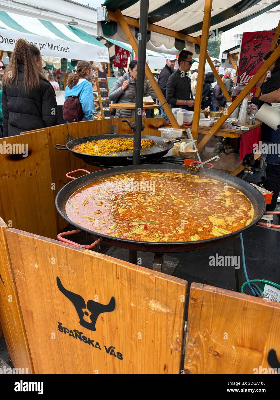 Outdoor food market with Spanish paella stall “ŠPANSKA VAS” serving ...