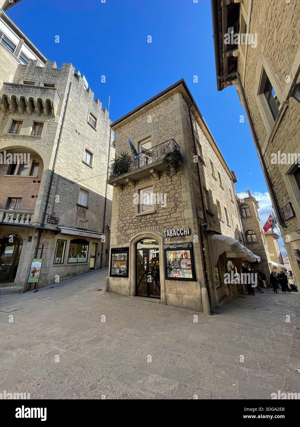 Historic street scene in the old town of San Marino, featuring stone ...