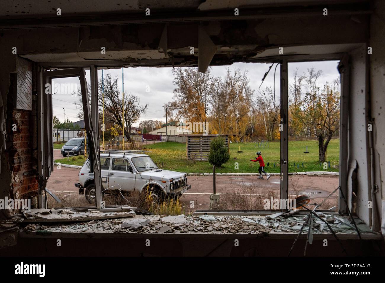 A young biathlete trains outside the destroyed ski base in Chernihiv, Ukraine, Thursday, Oct. 30 ...