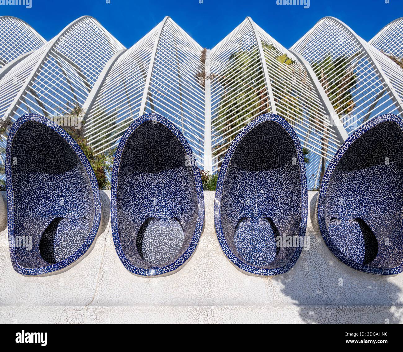 Dramatic blue mosaic booths line one side of the Umbracle; a landscaped ...