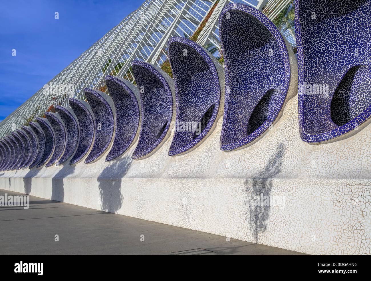 Dramatic blue mosaic booths line one side of the Umbracle; a landscaped ...