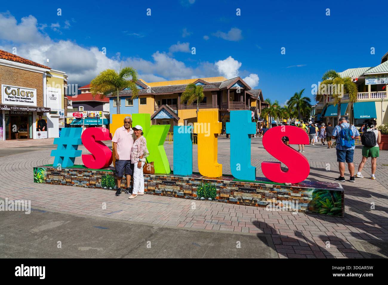 Tourists pose for photos by St Kitts welcome sign at Basseterre, St ...