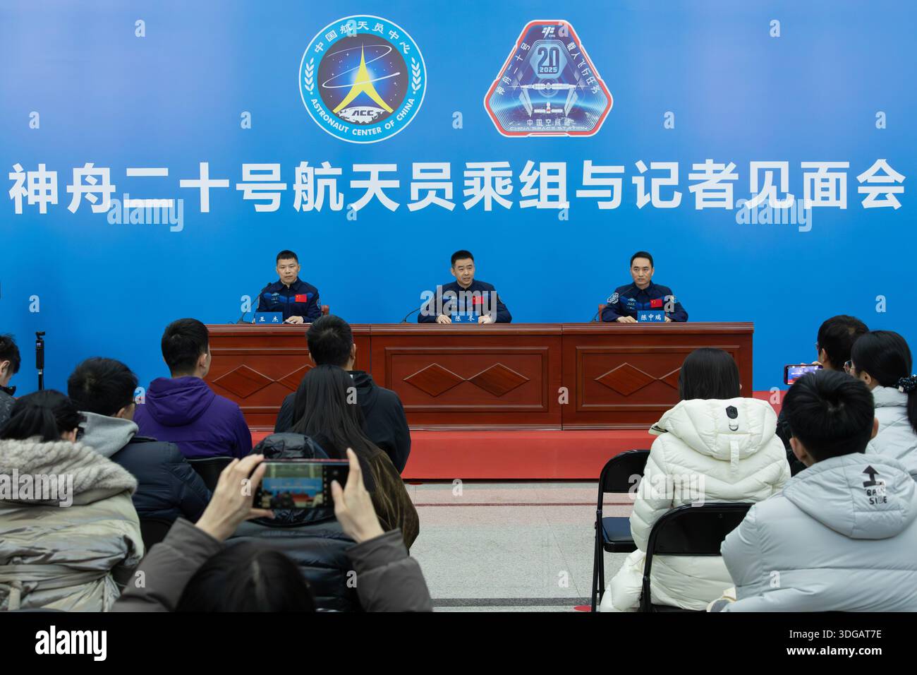 Beijing, China. 16th Jan, 2026. Astronaut Chen Dong (C) from China's ...