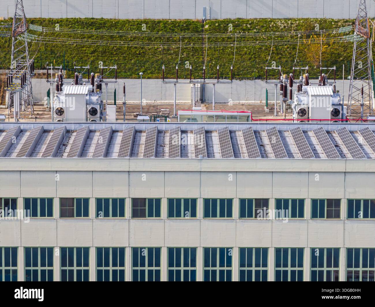Solar panels installed on a building roof convert sunlight into clean ...