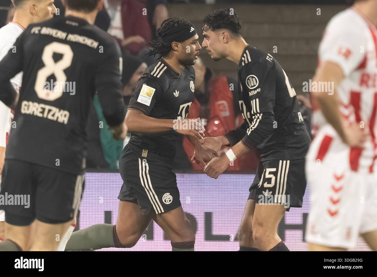 Koeln, Germany. 14th Jan, 2026. Aleksandar Pavlovic (FCB, R) gratuliert ...