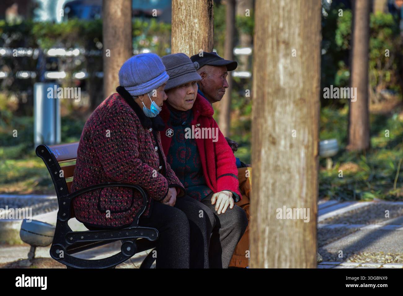 Fuyang City, China. 16th Jan, 2026. Three elderly friends sit closely ...