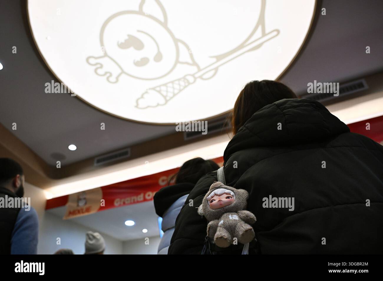 New York, USA. 15th Jan, 2026. A Labubu hangs off the shoulder bag of a ...