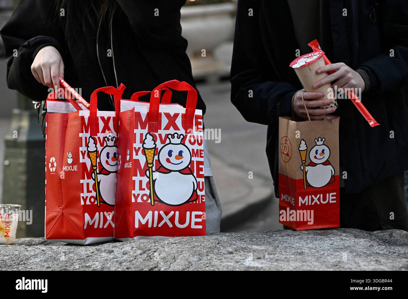 New York, USA. 15th Jan, 2026. Customers look through their Mixue ...