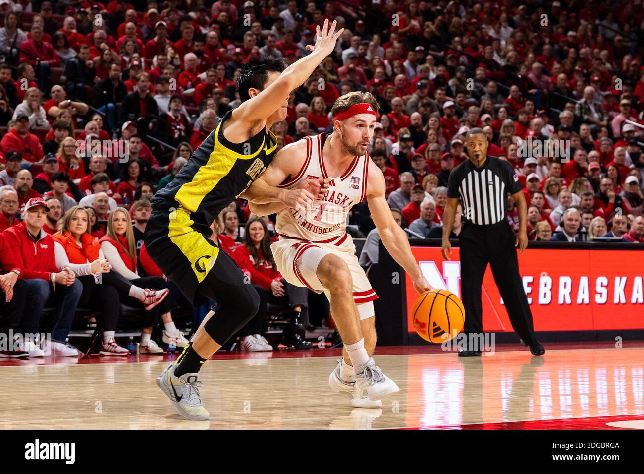 Nebraska guard Sam Hoiberg (1) moves the ball against Oregon during the ...