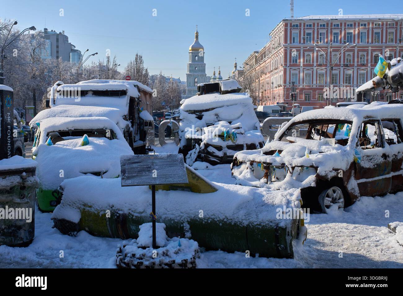 Snow covered, damaged Russian military vehicles are on display in ...