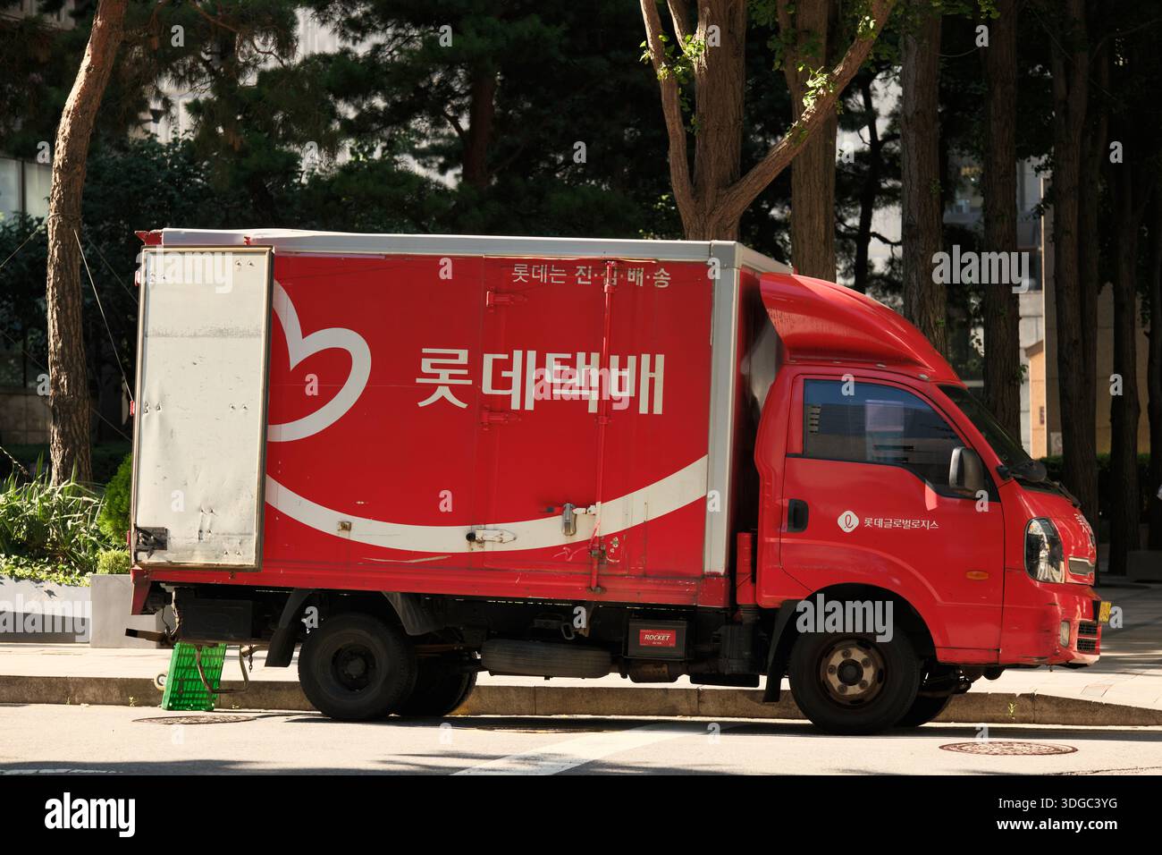 Seoul, South Korea: Red Lotte courier delivery truck parked on city ...