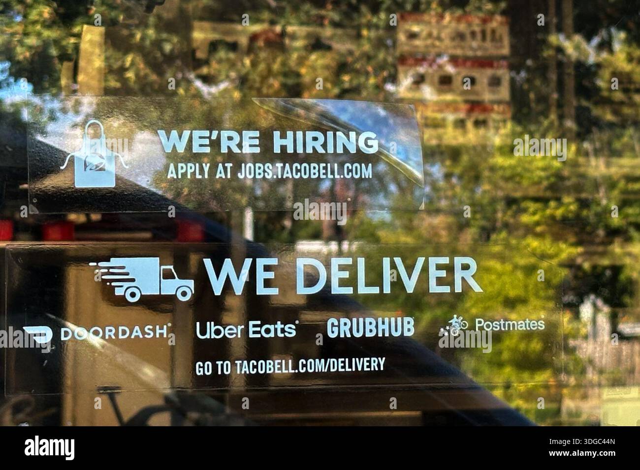 A hiring sign is displayed at a fast food restaurant in Wheeling, Ill ...