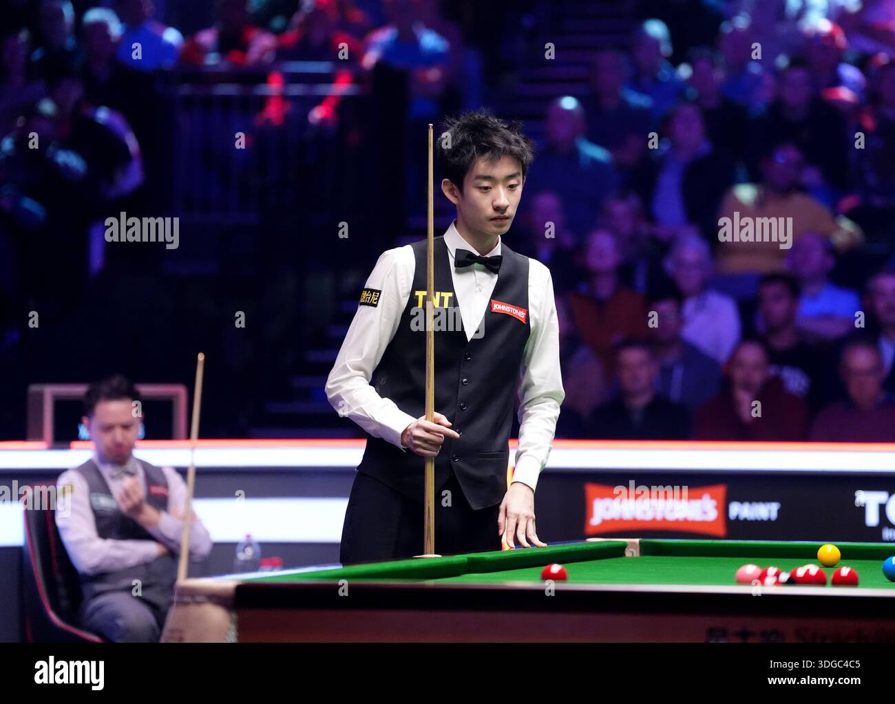 Wu Yize in action against Xiao Guodong (left) on day six of the 2026 ...
