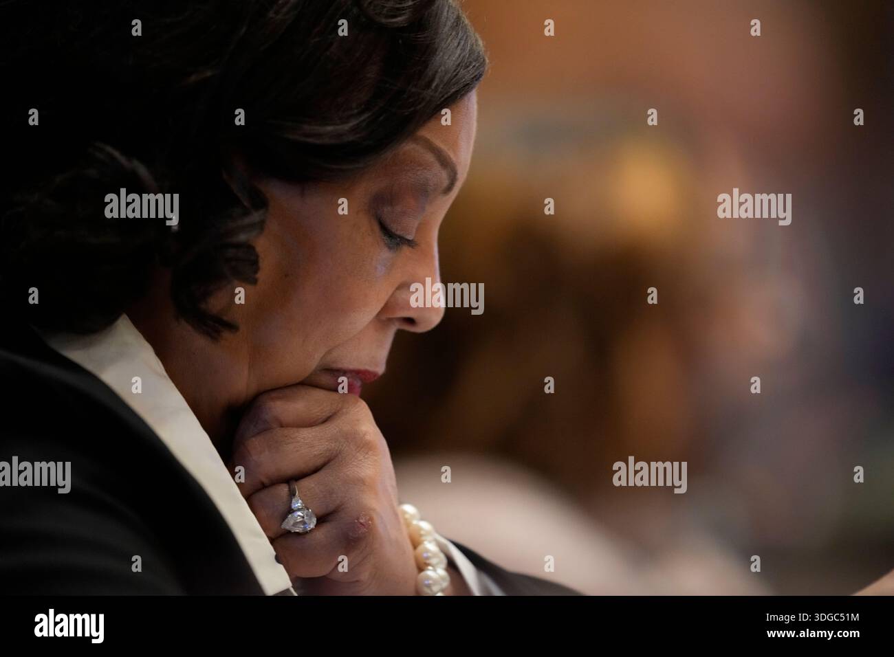 Rep. Angela Moore, a Democrat from Stonecrest, listens to Gov. Brian ...