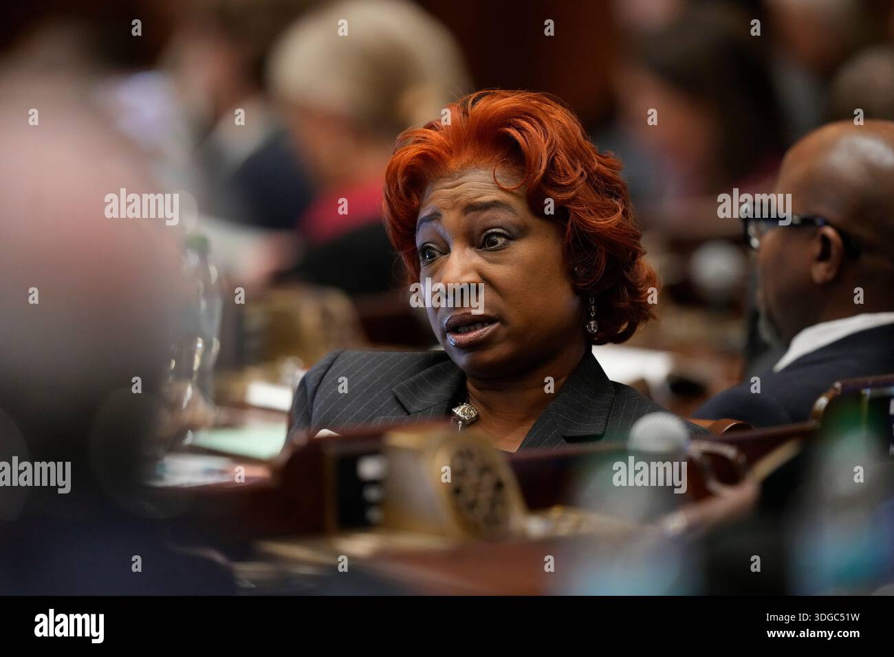 Rep. Rhonda Taylor, a Democrat from Conyers, listens to Gov. Brian Kemp ...
