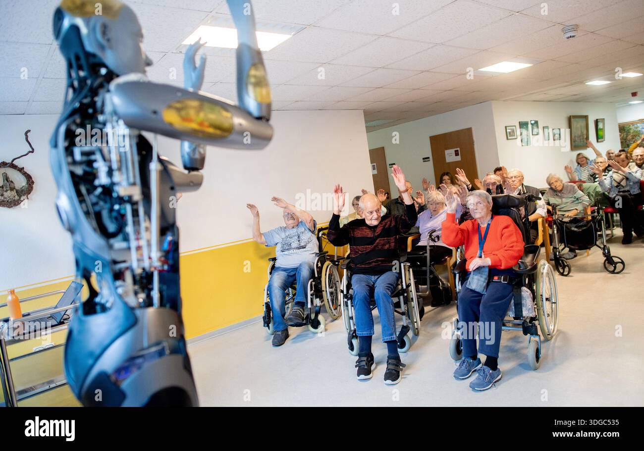Leer, Germany. 14th Jan, 2026. The humanoid robot "Ameca" leads sitting ...