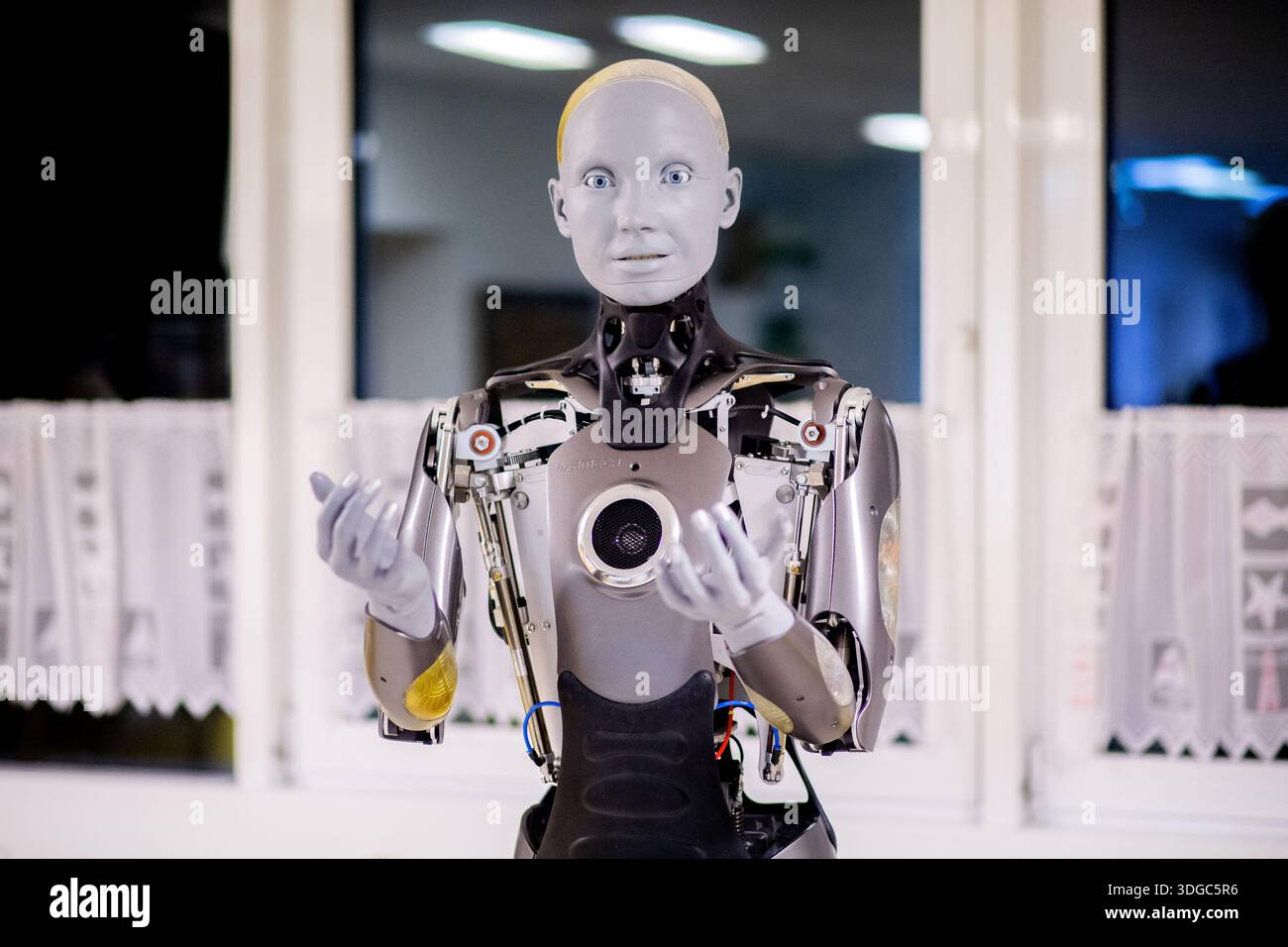 Leer, Germany. 14th Jan, 2026. The humanoid robot "Ameca" leads sitting ...