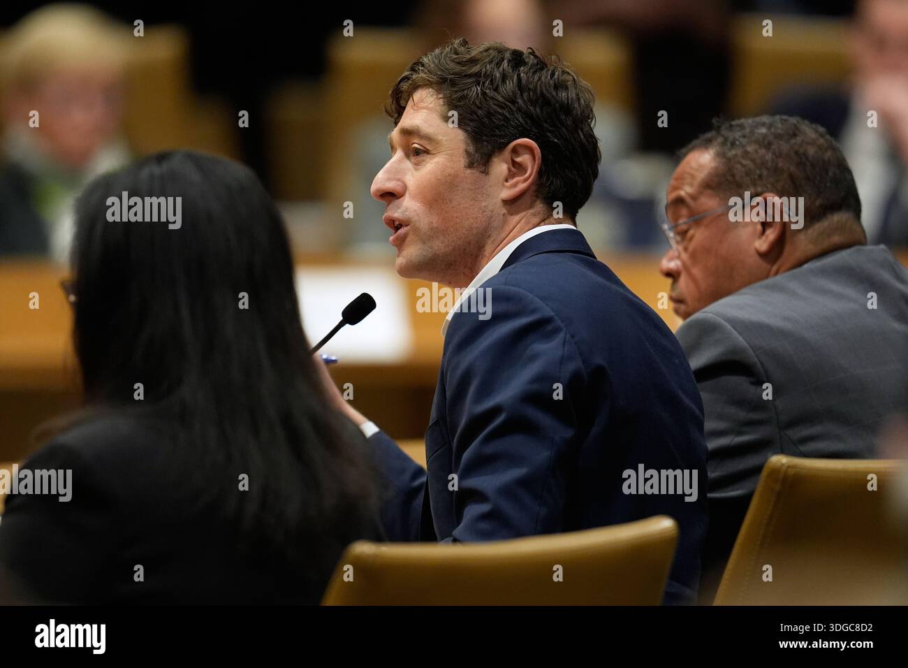 Minneapolis Mayor Jacob Frey, middle, speaks during a field hearing on ...