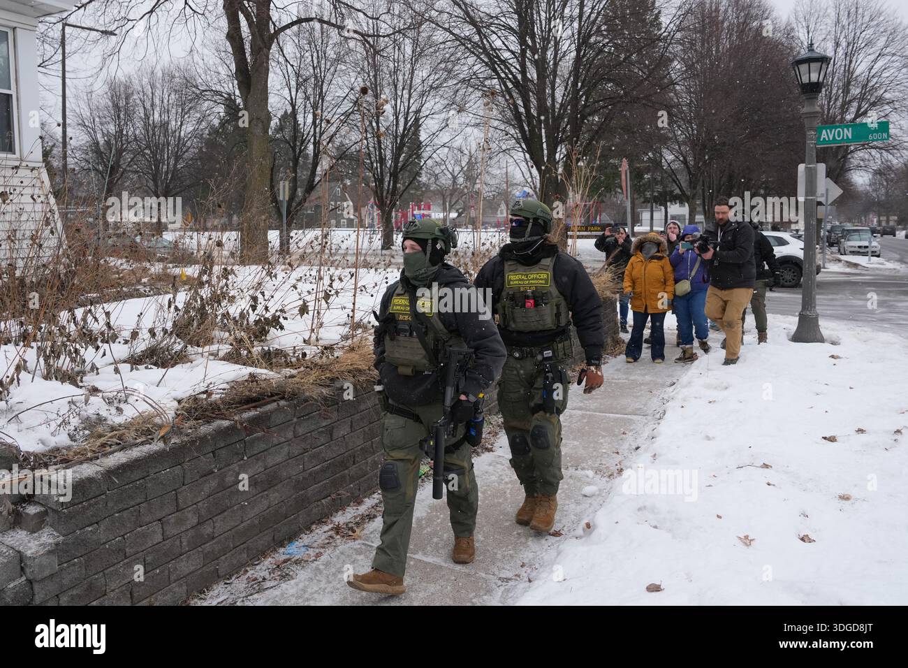 People film Federal Enforcement officers on Friday, Jan. 16, 2026, in ...