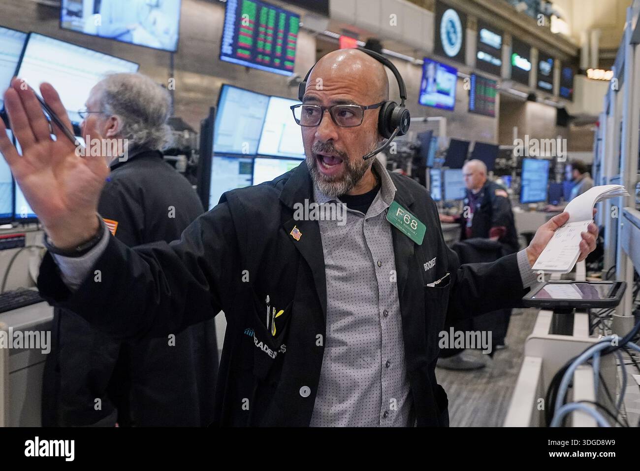 Options trader Steven Rodriguez works on the floor of the New York ...