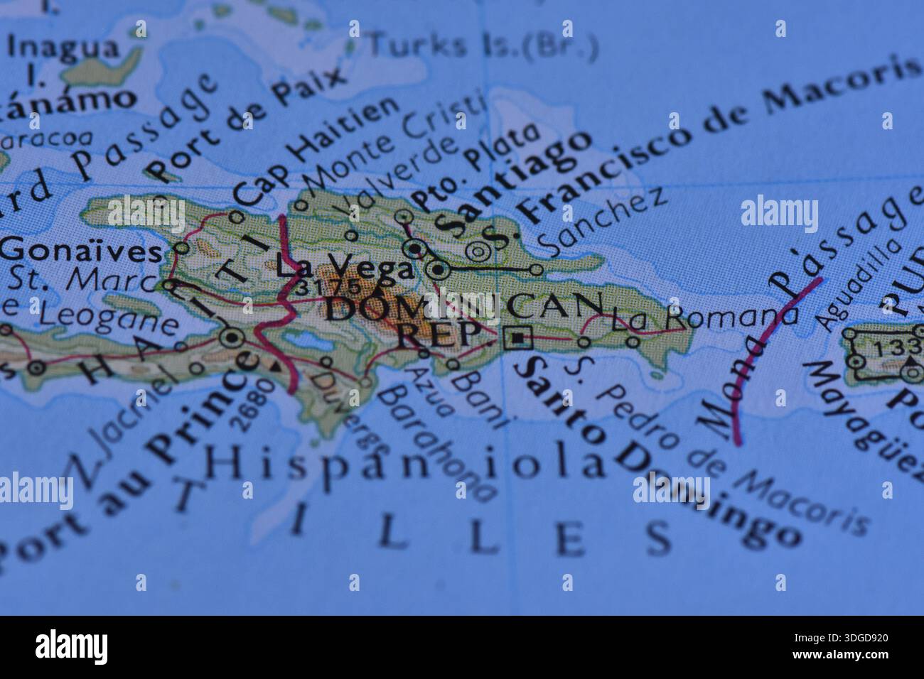Macro view of a printed atlas map showing the island of Hispaniola ...