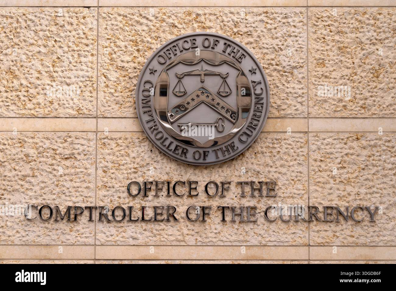 The logo for the Office of the Comptroller of the Currency is seen ...