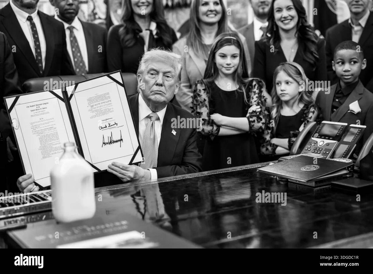 Desk surrounded Black and White Stock Photos & Images - Alamy