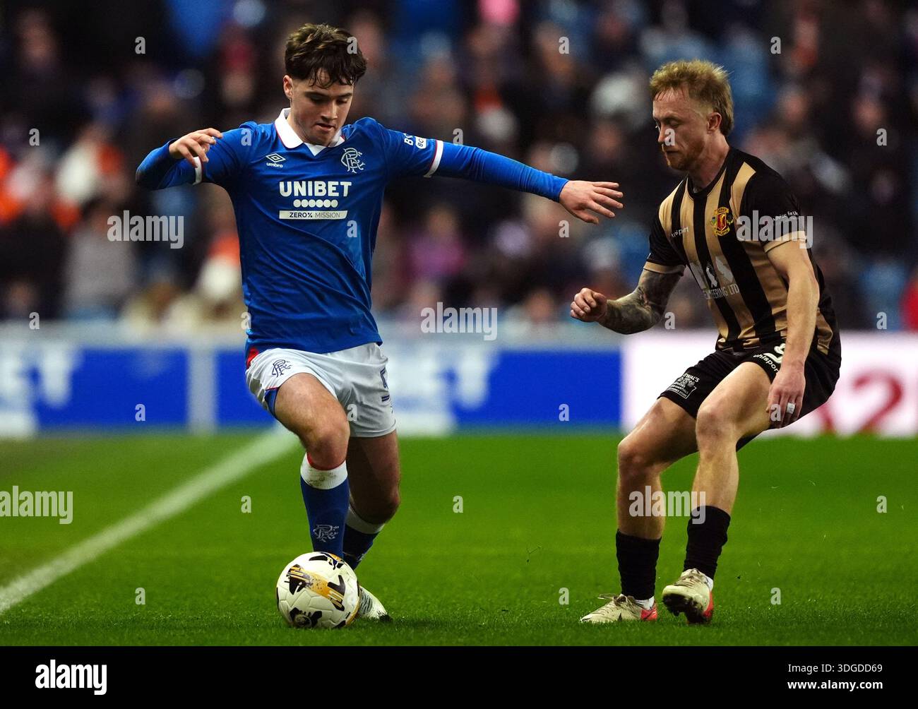 Rangers' Findlay Curtis (left) and Annan Athletic's Aidan Smith battle ...