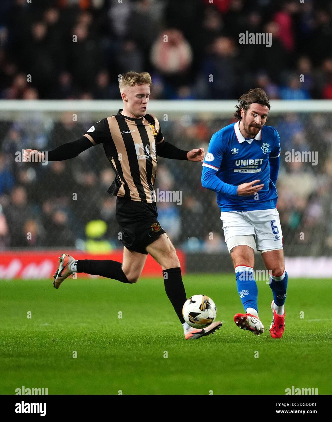 Annan Athletic's Josh Dixon (left) and Rangers' Joe Rothwell battle for ...