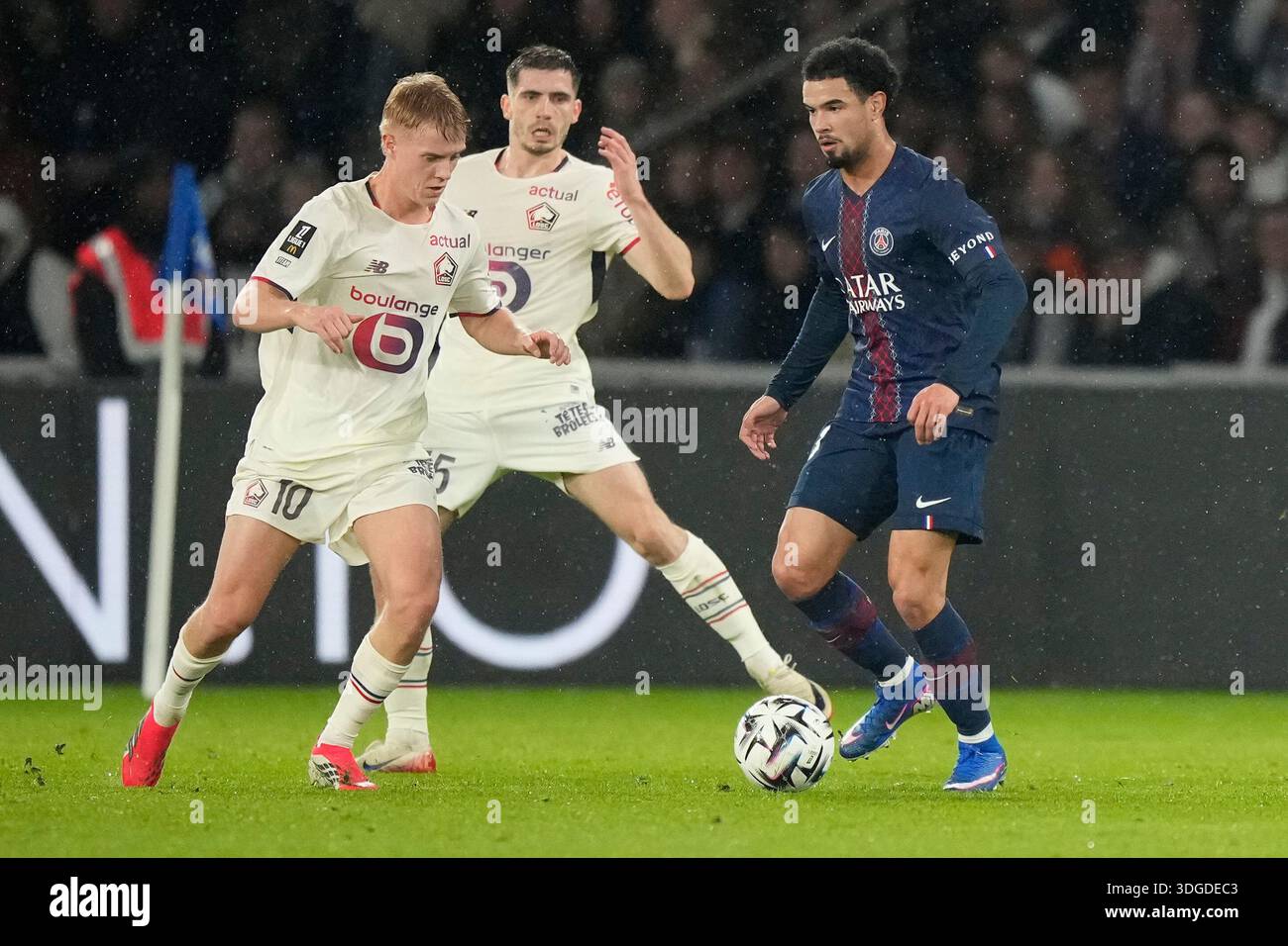 Lille's Hakon Arnar Haraldsson, left, challenges for the ball with PSG ...