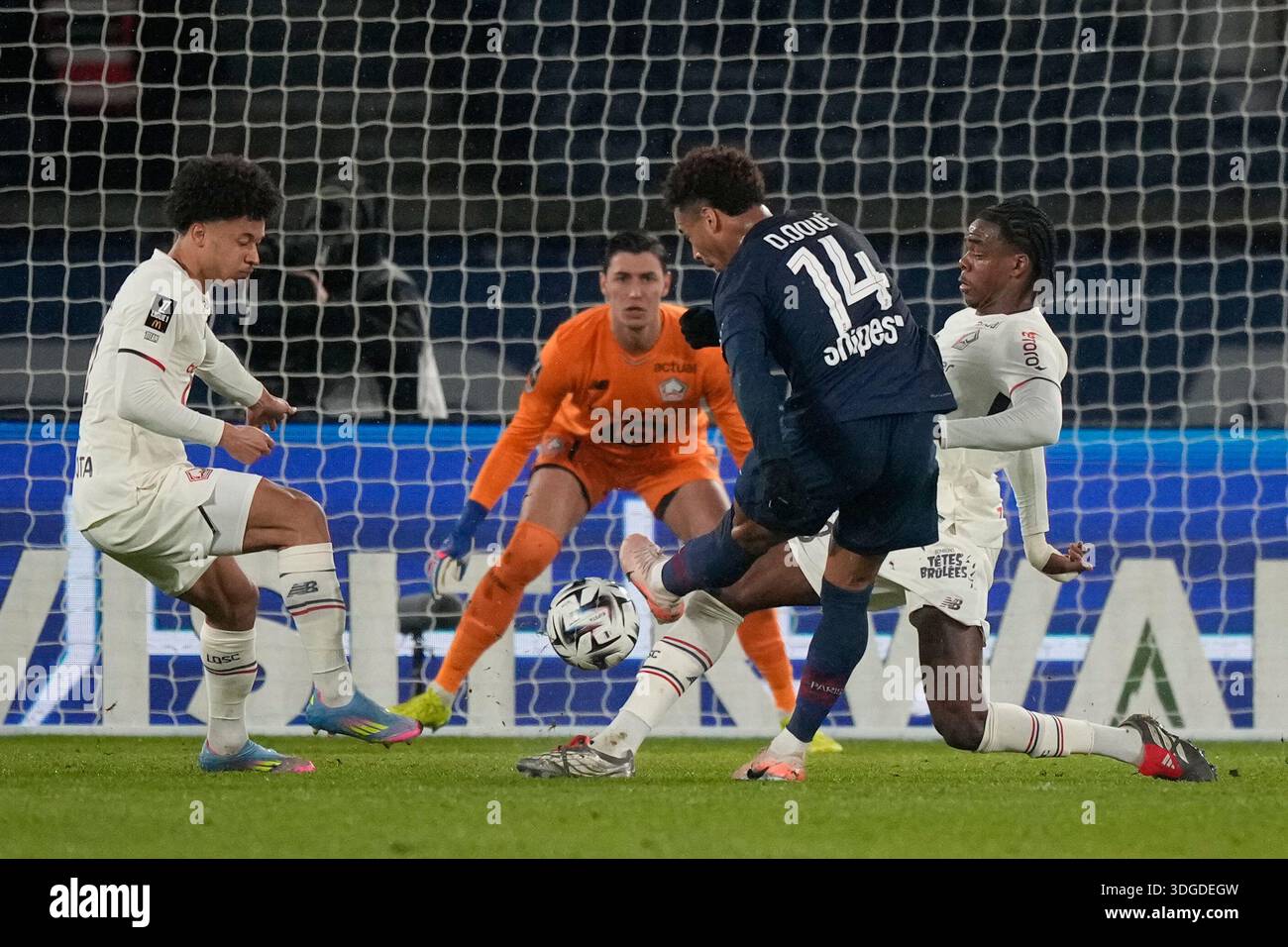 PSG's Desire Doue makes an attempt to score past Lille's Nathan Ngoy ...