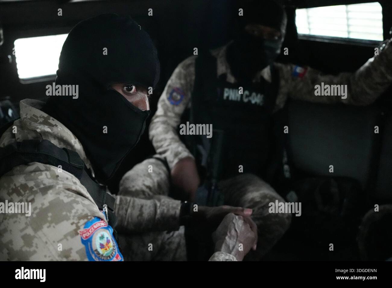 Police patrol on an armored vehicle a gang controlled area in downtown ...