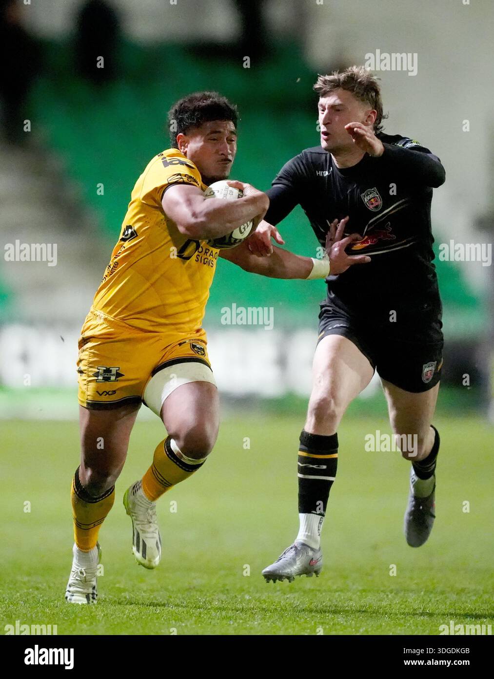 Dragon's Fine Inisi gets past Newcastle's Alex Hearle during the ECPR ...