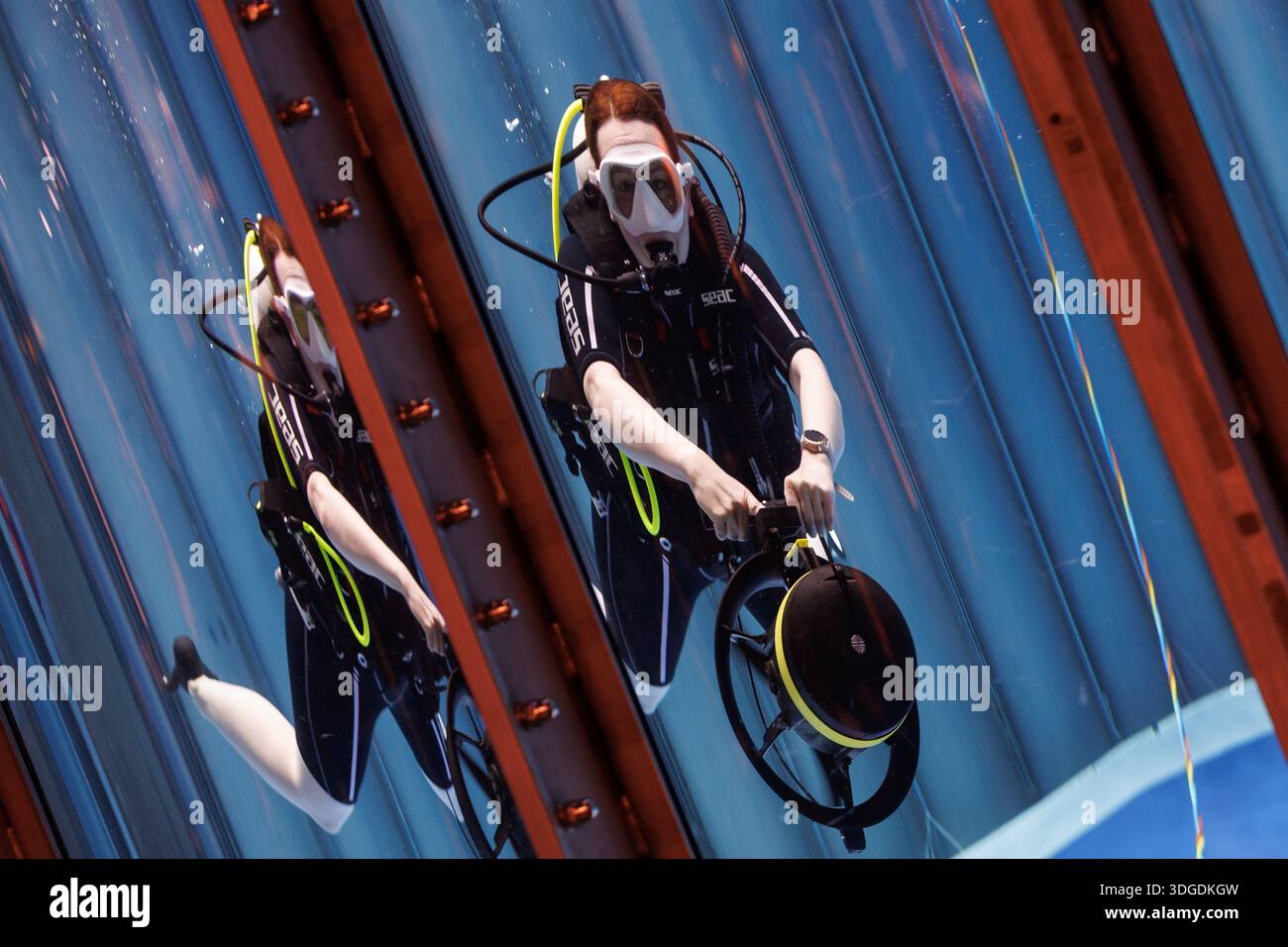 A diver demonstrates underwater propulsion equipment in a pool at the ...