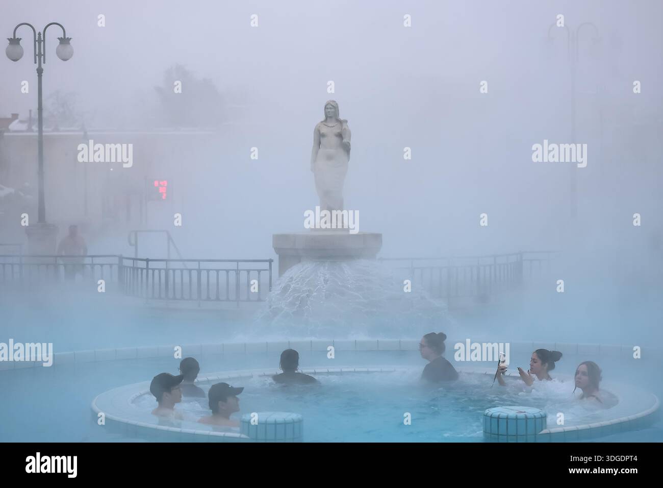 Budapest. 16th Jan, 2026. Visitors enjoy a thermal bath in the open air ...