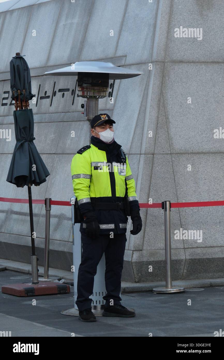 Seoul, South Korea: Korean police officer wearing mask and winter ...