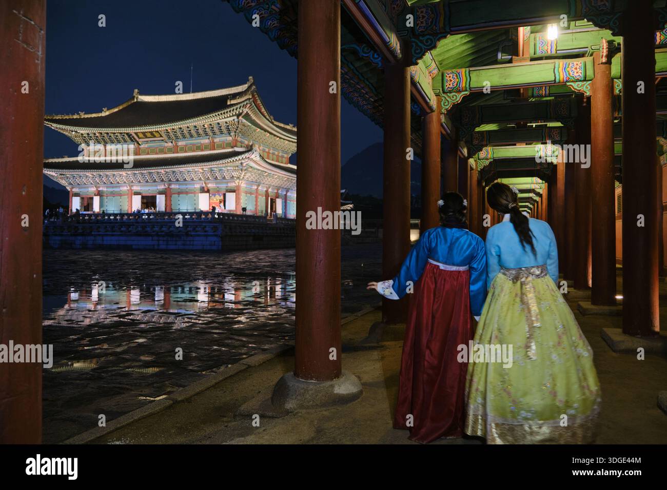 Seoul, South Korea: Two women wearing traditional hanbok walking ...
