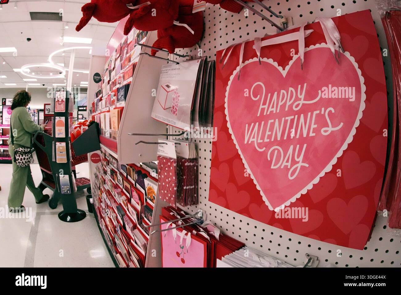 A shopper walks past a display of Valentine's Day merchandise in a ...
