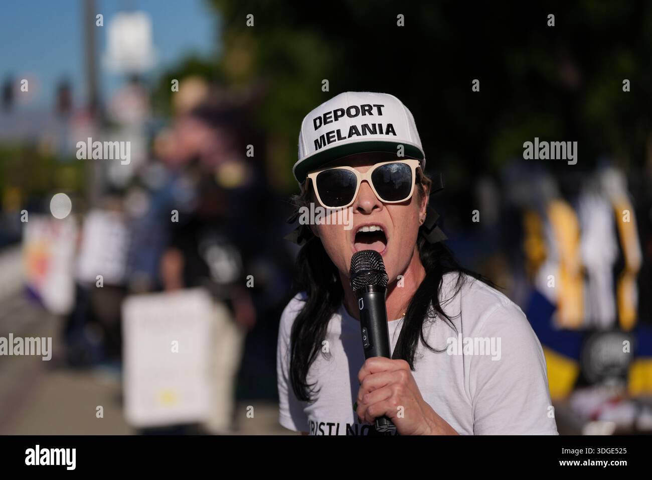 A demonstrator shouts slogan during a protest to denounce the Trump ...