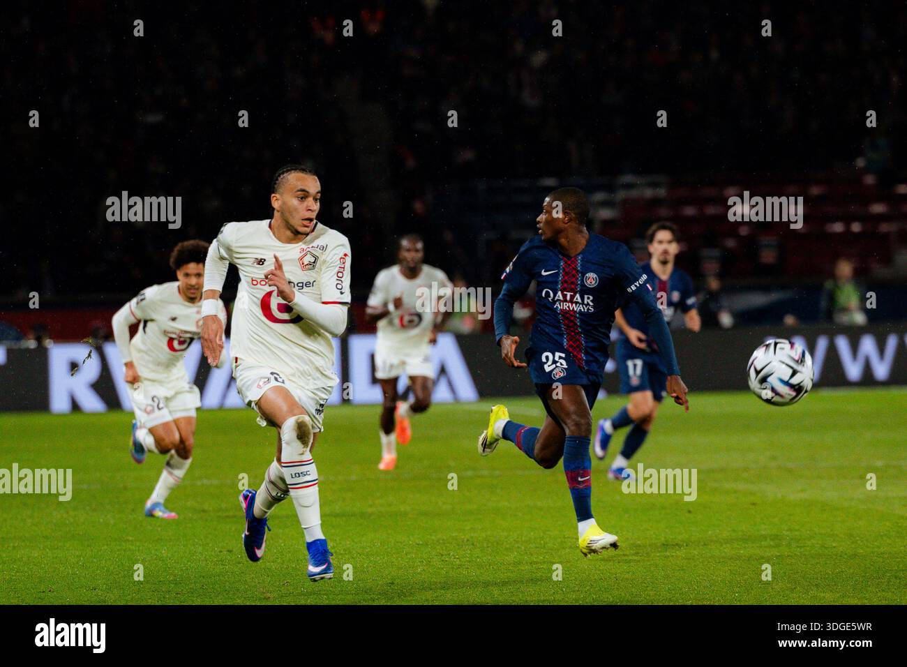 Ethan Mbappe of LOSC and Nuno Mendes of Paris Saint-Germain during the ...