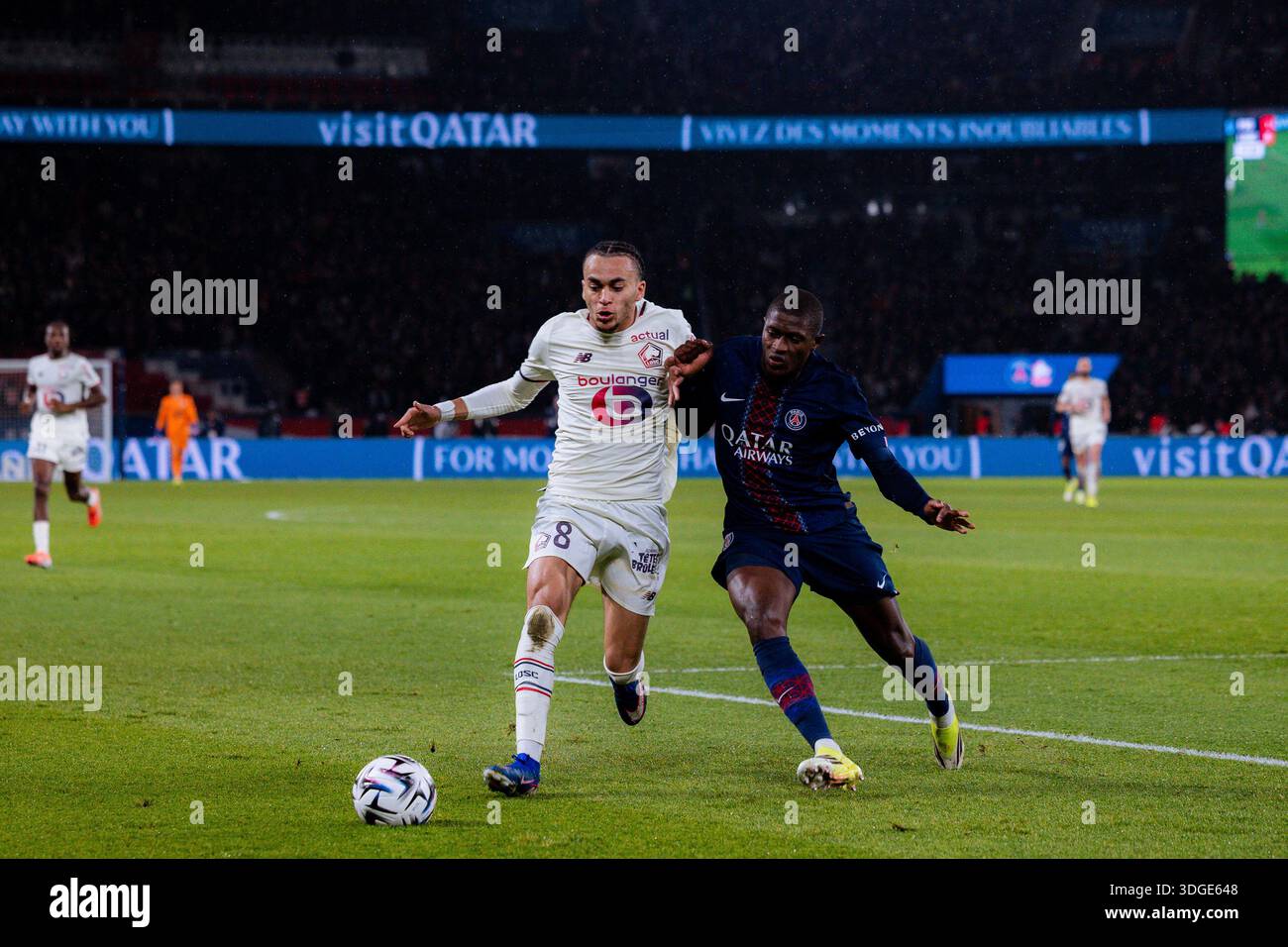 Ethan Mbappe of LOSC and Nuno Mendes of Paris Saint-Germain during the ...