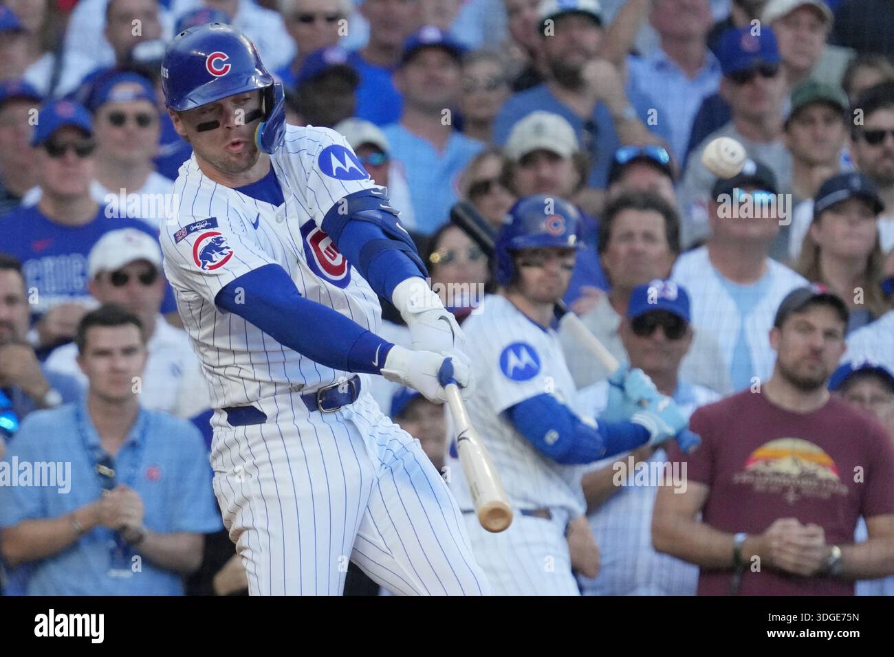 FILE - Chicago Cubs' Nico Hoerner hits a sacrifice fly ball during a ...