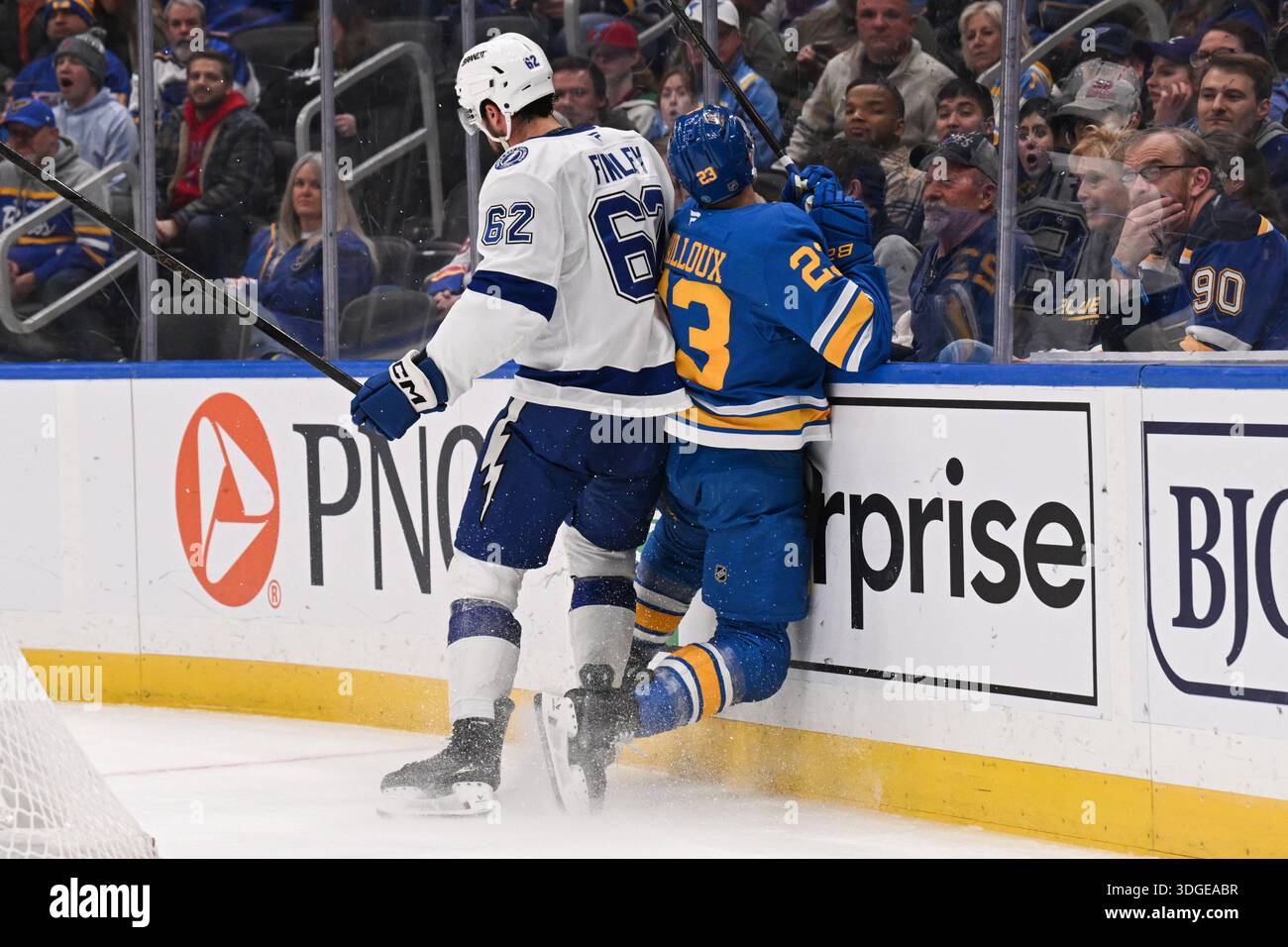 St. Louis Blues' Logan Mailloux, right, is checked by Tampa Bay ...