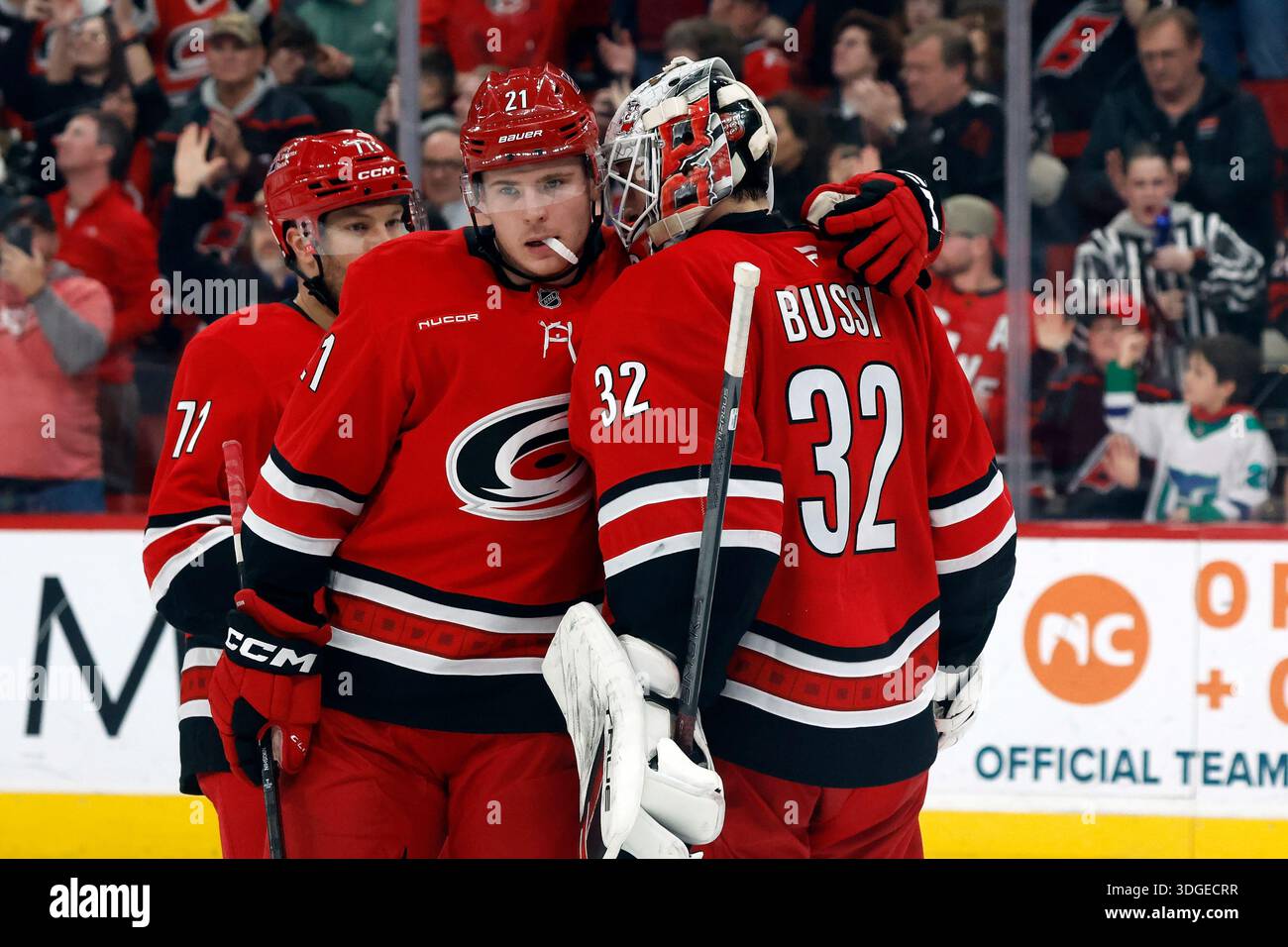 Carolina Hurricanes goaltender Brandon Bussi (32) is congratulated by ...