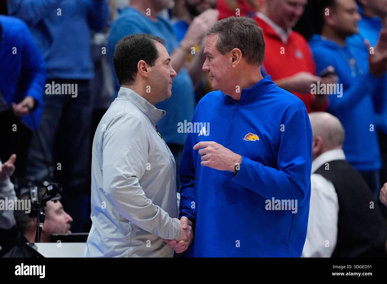 Baylor head coach Scott Drew, left, and Kansas head coach Bill Self ...