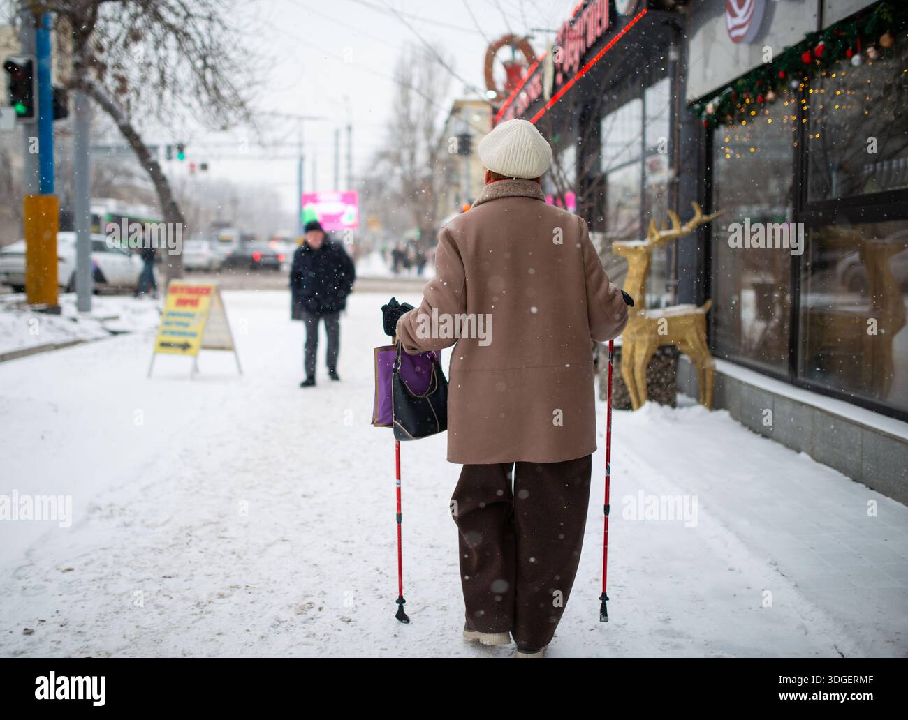 Almaty, Kazakhstan. 16th Jan, 2026. A pedestrian walks amid snowfall on ...