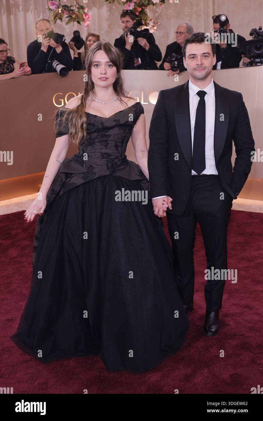 Aimee Lou Wood and Adam Long attend the 83rd annual Golden Globe Awards ...