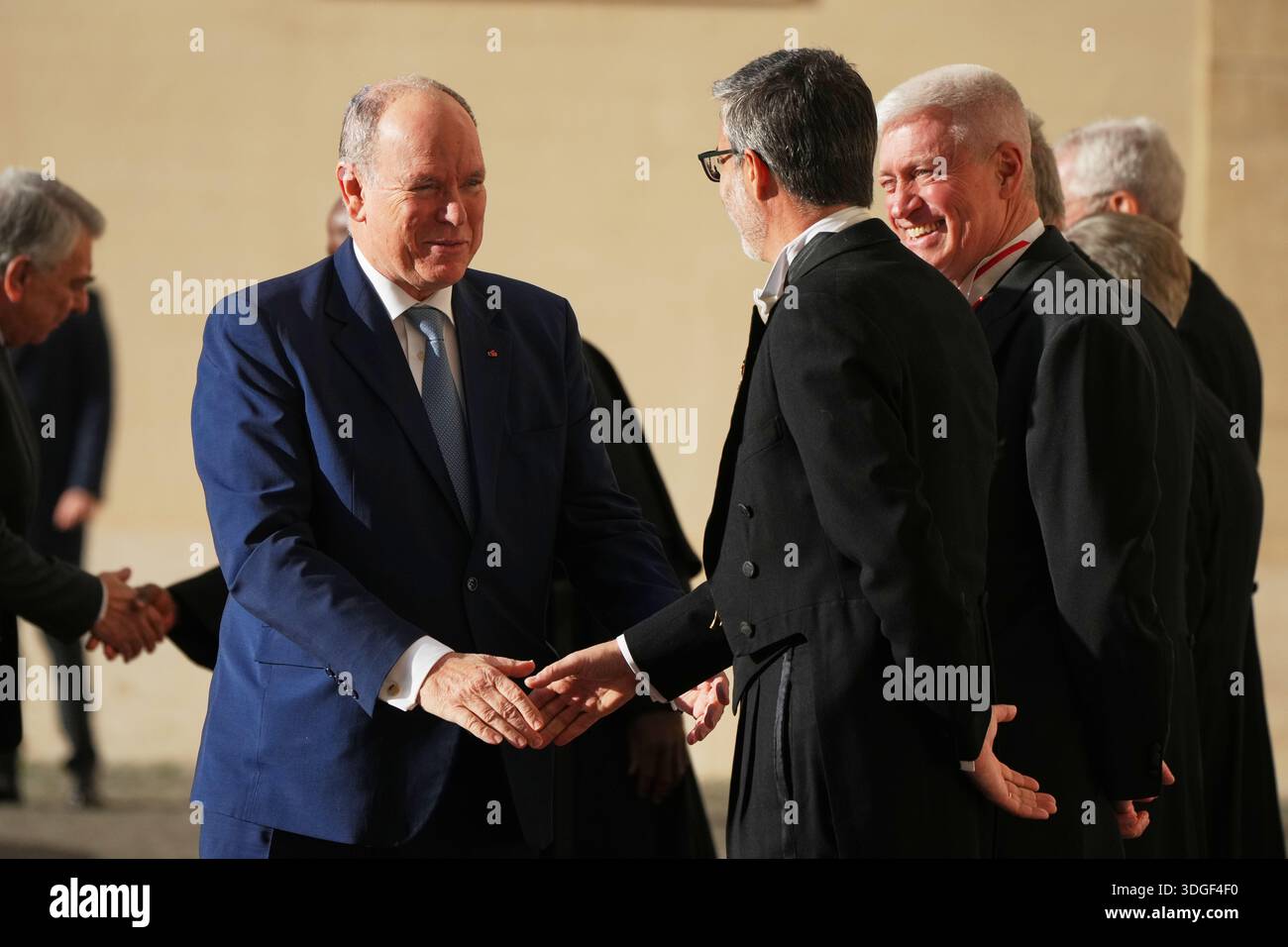 Prince Albert II of Monaco, left, greets Vatican members of staff ...